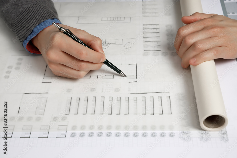 Architect hand drawing building plan sketch with mechanical pencil ...