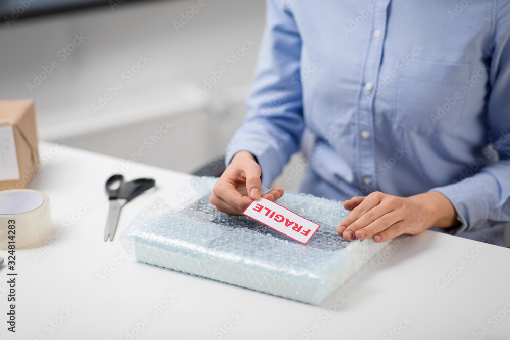 delivery, mail service, and shipment concept - close up of woman ...