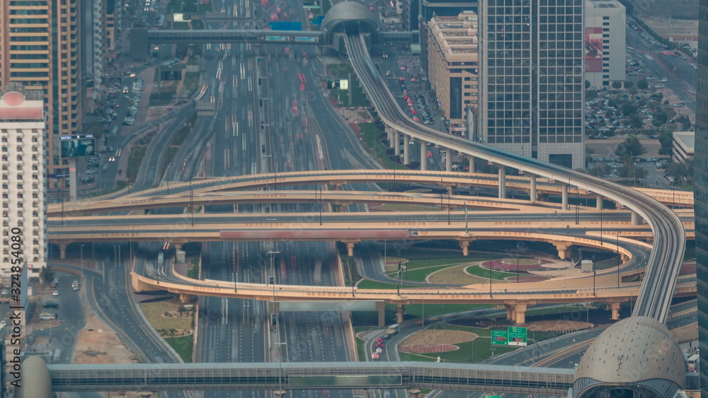 Aerial view of highway junction with traffic timelapse in Dubai, UAE ...