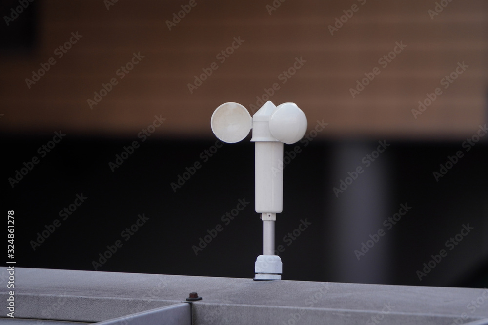 White mechanical wind speed and pressure sensor-anemorumbometer. The ...