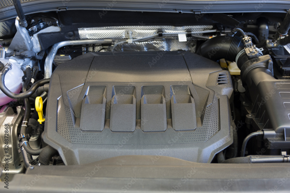 The engine compartment of a modern car. View of the engine compartment ...