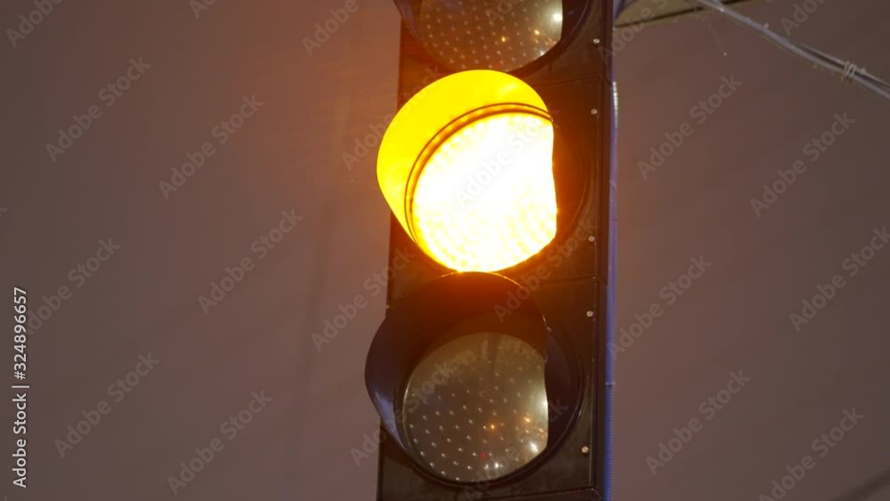 Night city street scene, cars stop yellow traffic light flashing. Stock ...