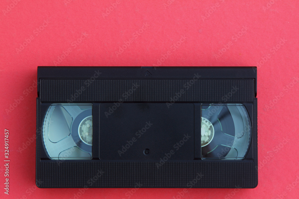 Stack of VHS video tapes as background. Old video cassette tapes. Retro ...