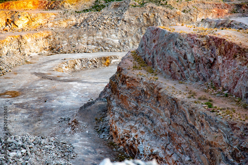 Deep and extensive outdoor excavation in a stone quarry exploited ...