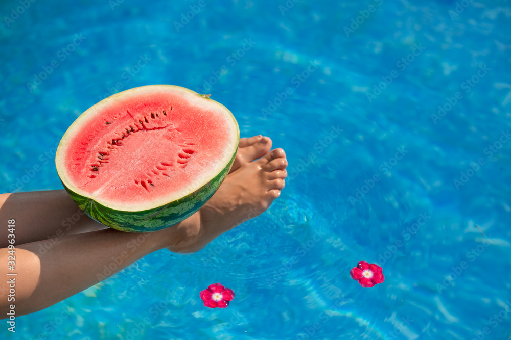 Watermelon in pool on woman slim legs in summer holiday time. Instagram ...