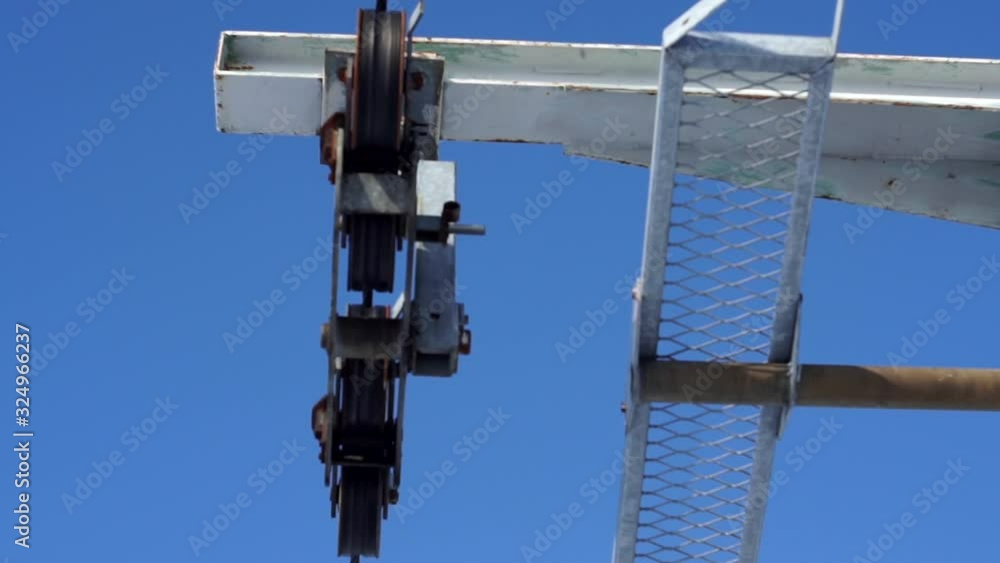 Cable car mechanism with metal rope in working process on a bright ...