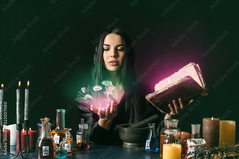 Female alchemist making potion on dark background Stock Photo | Adobe Stock