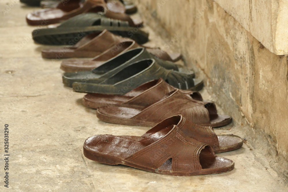 Arabic muslim leather sandals removed in front of mosque before praying ...