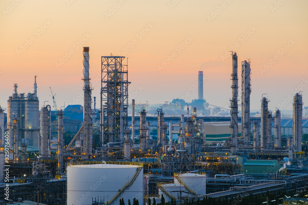 Oil and gas refinery plant or petrochemical industry on sky sunset ...