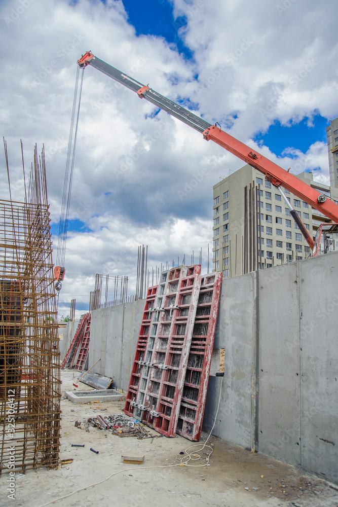 Building monolithic walls with a crane. Stock Photo | Adobe Stock