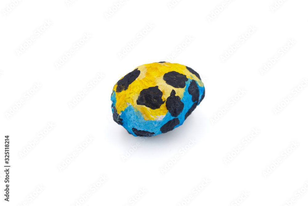 Round hand-crafted papier mache objects, painted in different colors ...