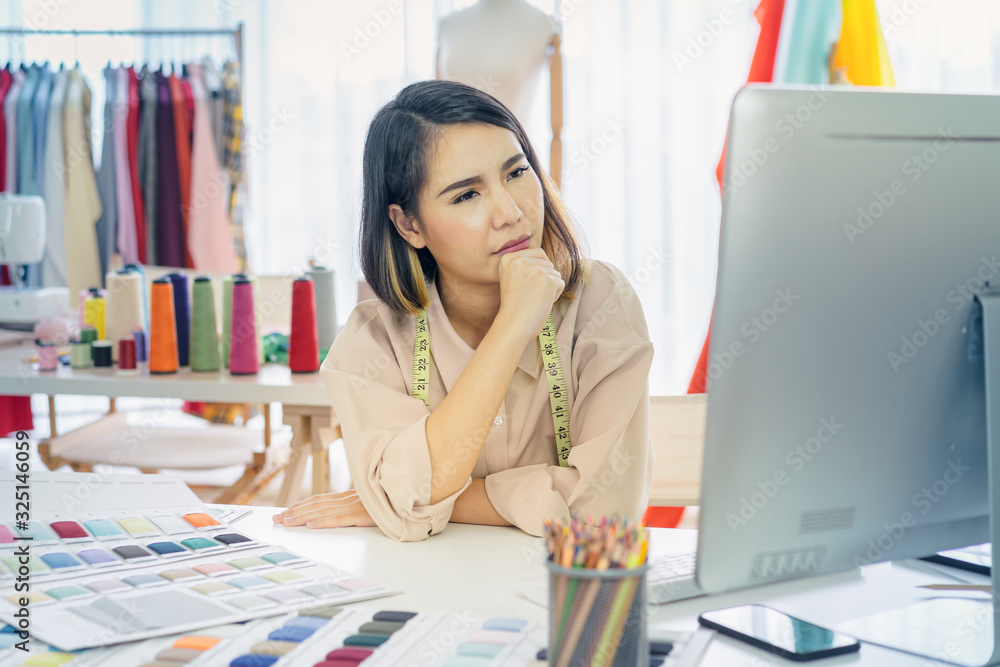 Female Fashion Designer At Work