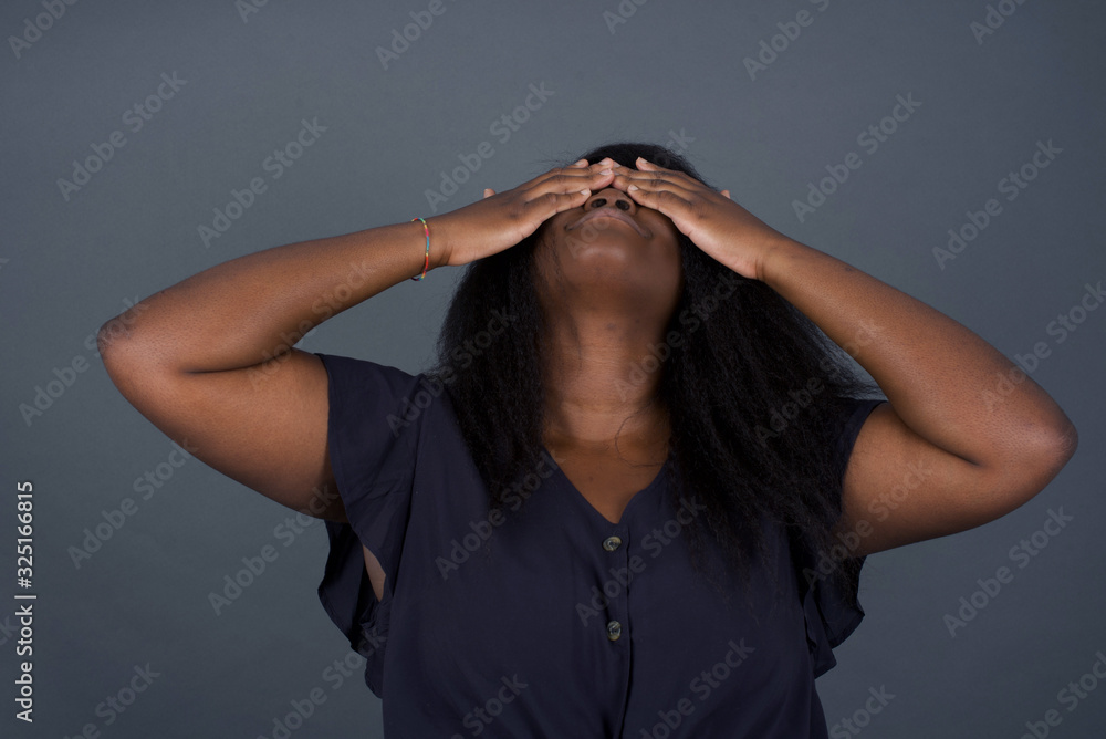 Shocked panic African American girl dressed in stylish clothing holding ...