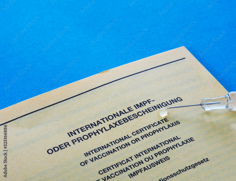 Impfpass mit Spritze Stock Photo | Adobe Stock