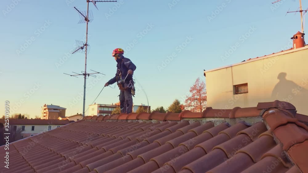 Rope access engineer wearing full body safety harness hardhat ...