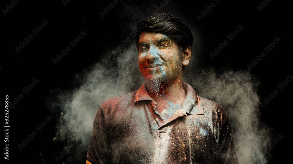Young man with holi colors. holi is a festival of India. It is festival ...