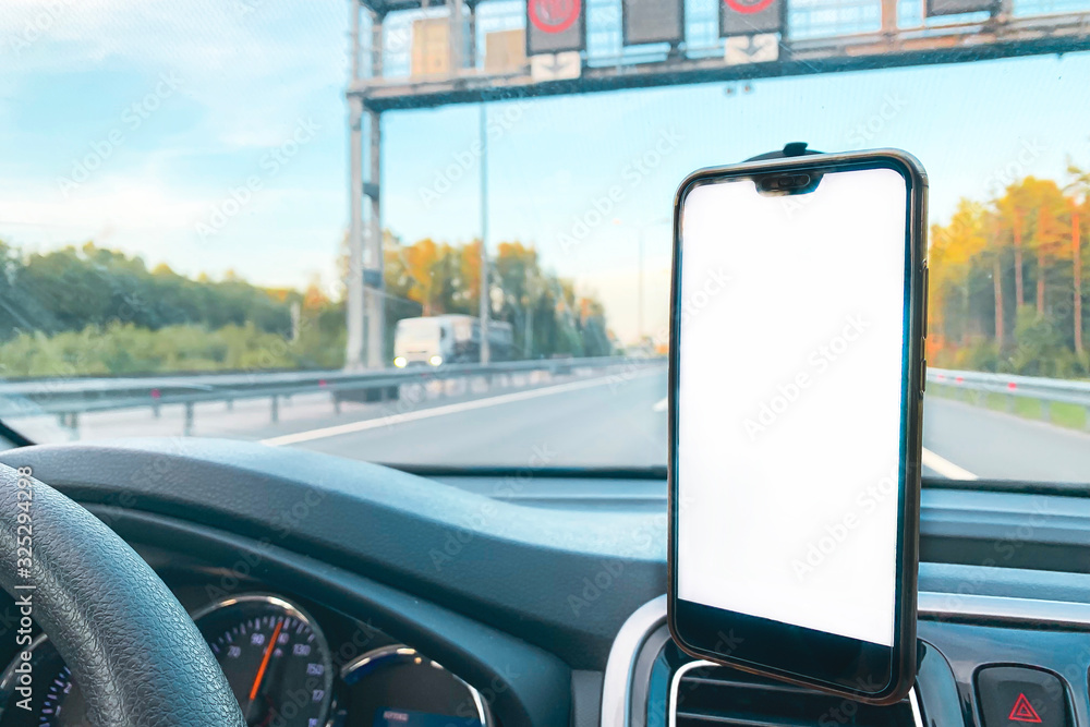 The smartphone in the car is used for navigation or GPS. The movement ...