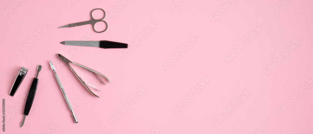 Manicure and pedicure tools on pink background. Top view with copy ...
