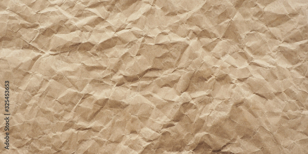.background and texture crumpled craft paper. Many folds and creases ...