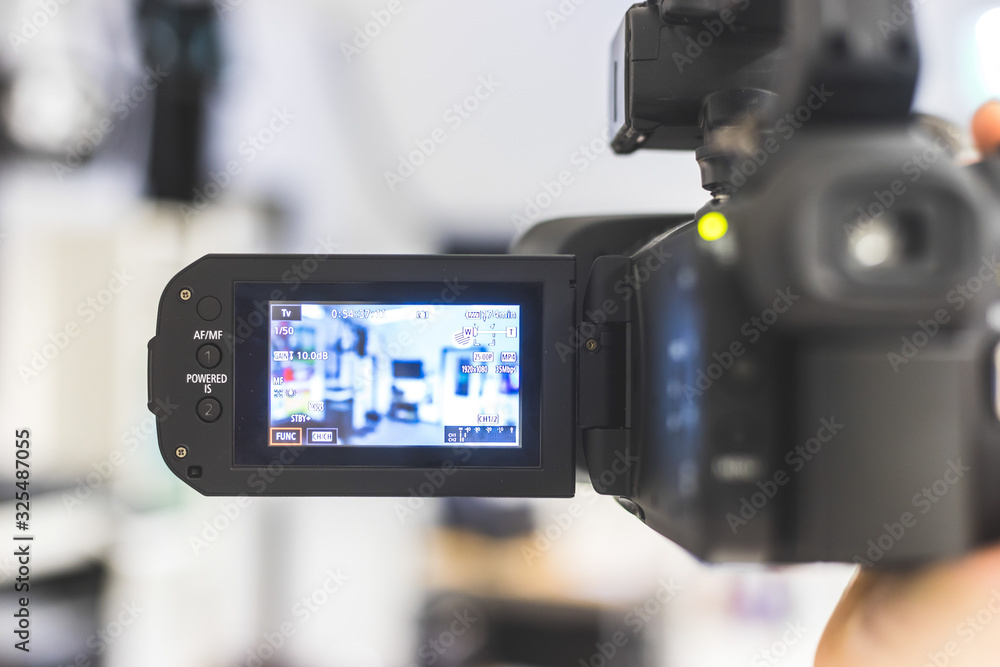 Professional film production: Male filmmaker is recording with a ...