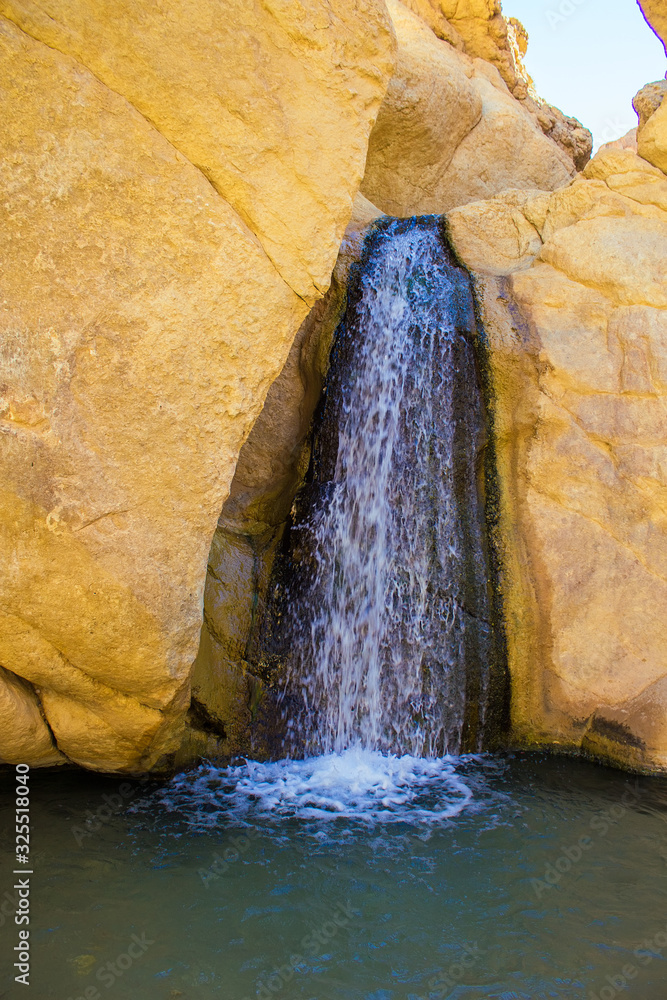 Waterfall in mountain oasis Chebika at border of Sahara, Tunisia ...