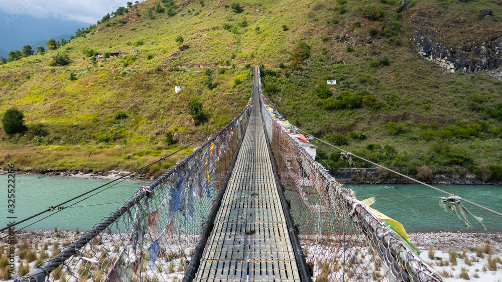 The Punakha Suspension Bridge at the Punakha Dzong. Across the Tsang ...