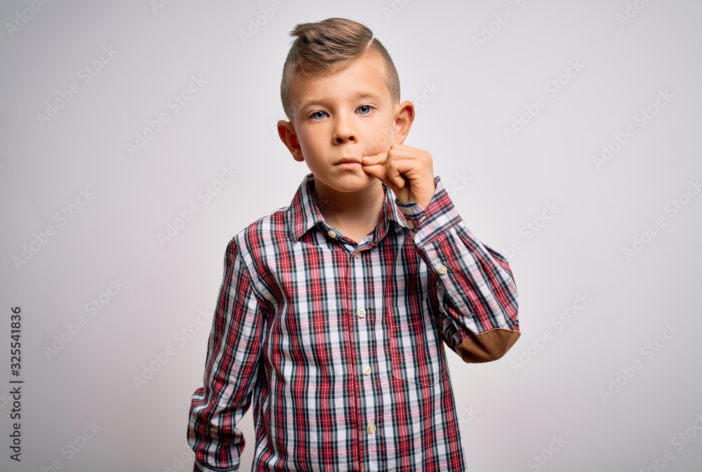 Young little caucasian kid with blue eyes wearing elegant shirt ...