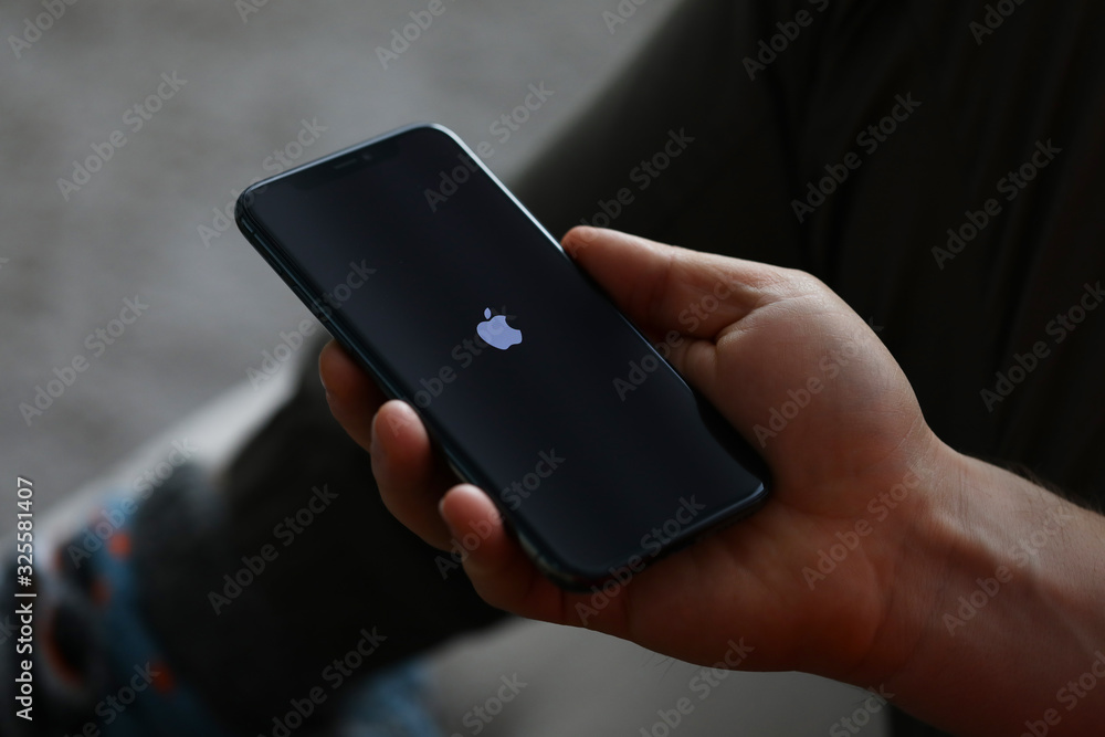 Male hand hold Apple iphone pro Stock Photo | Adobe Stock