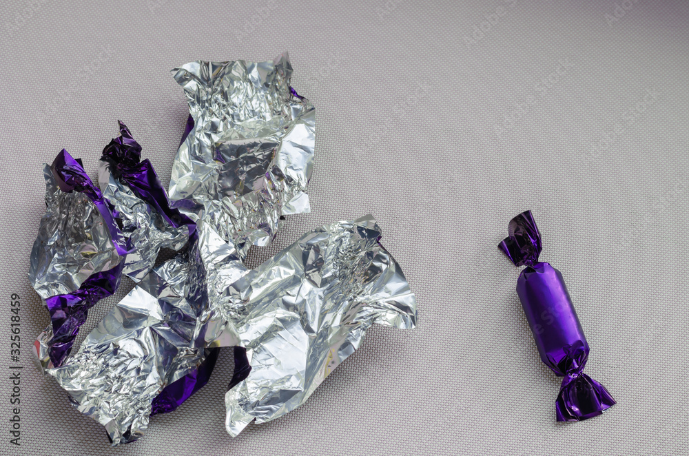 Candy and candy wrappers. The only candy and a bunch of empty wrappers ...