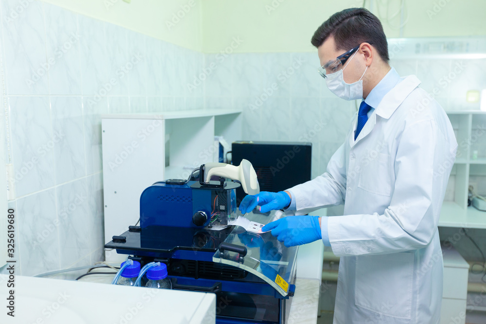 DNA laboratory. The expert puts the human DNA into the database using ...