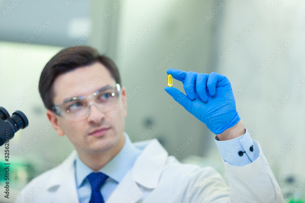 Scientist studies properties and benefits of omega 3 fatty acids using ...