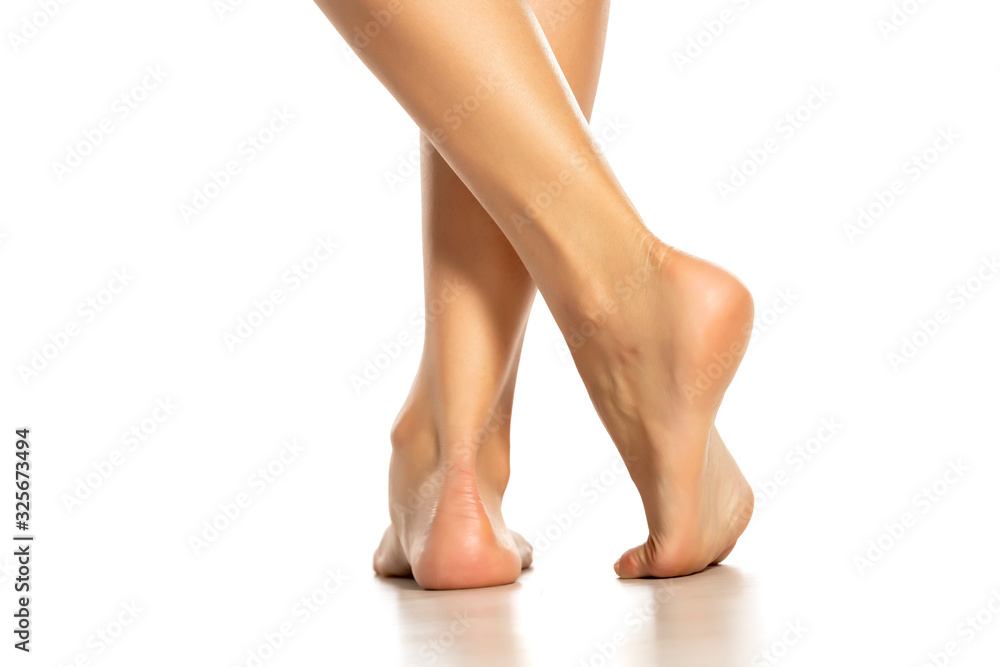 beautiful female foot on white Stock Photo | Adobe Stock