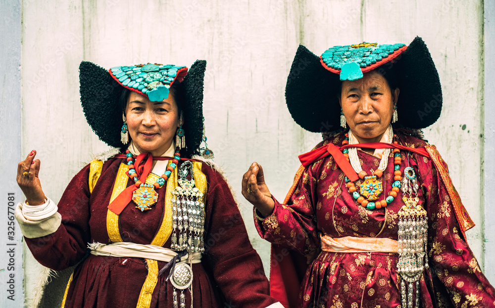 Portrait of women in traditional tibetan clothes inside their house in ...