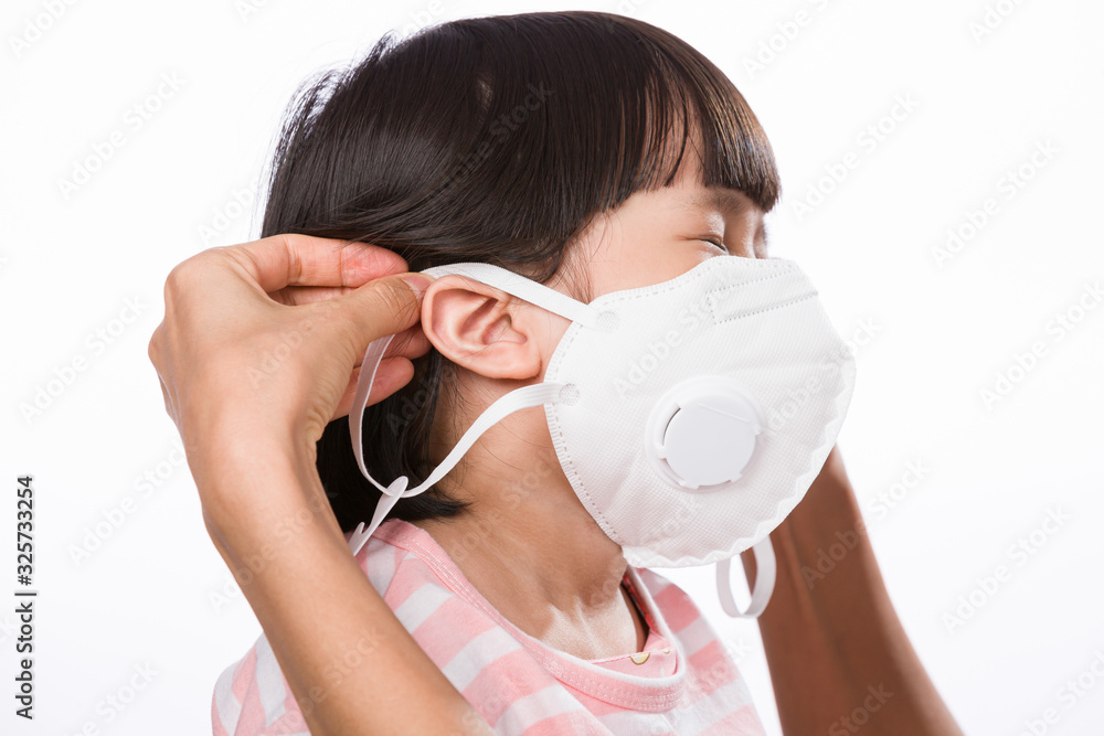 Mother wearing N95 mask protection for her daughter on white background ...