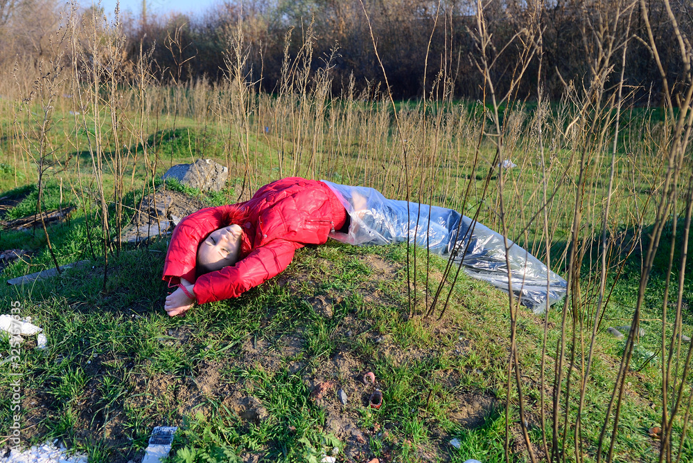 Dead woman lying on landfill Stock Photo | Adobe Stock
