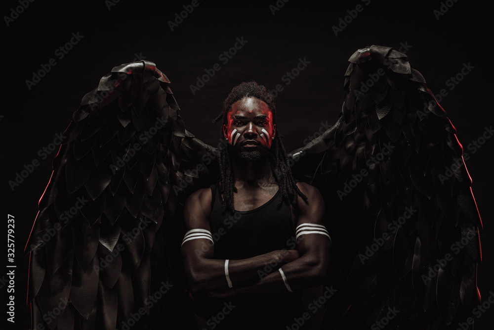 portrait of african man, black serious muscular angel from heaven ...