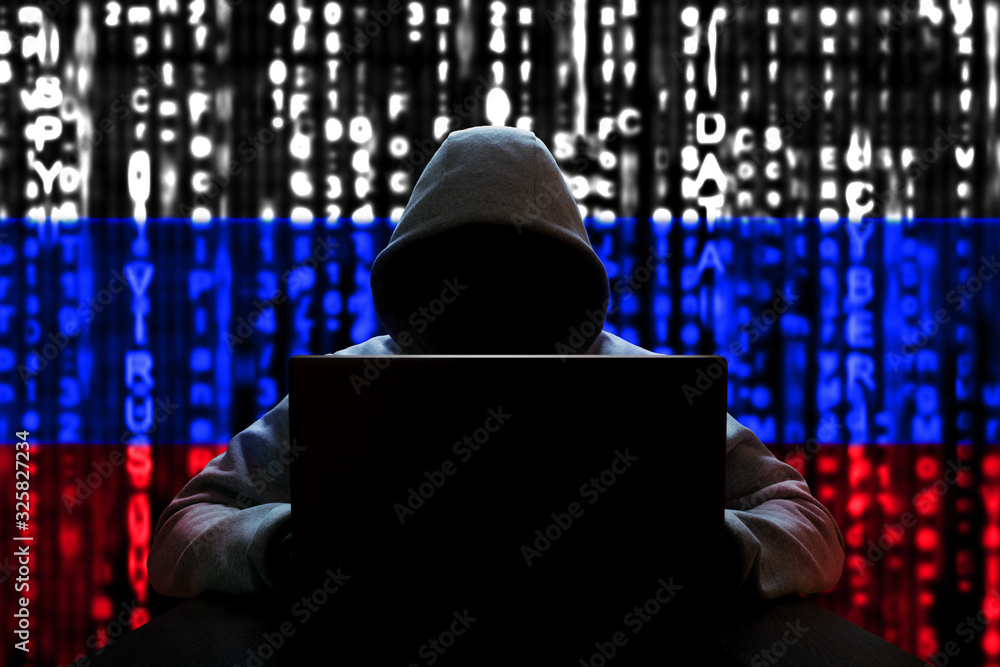 Cyber threat from Russia. Russian hacker at the computer, on a ...