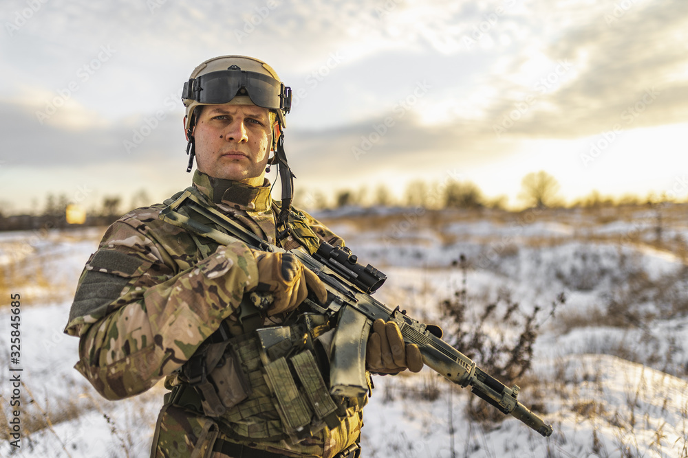 military army man soldier posing in the winter multicam camouflage ...