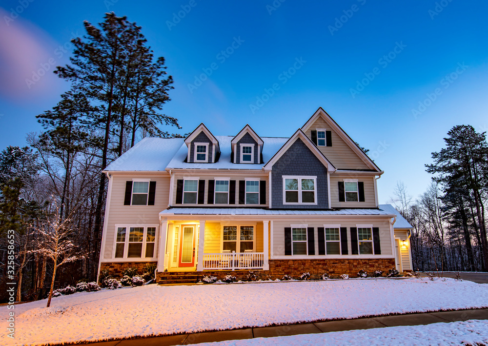 Beautiful American luxury home on a snowy morning Stock Photo | Adobe Stock