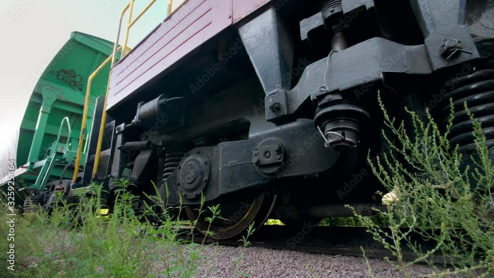 4k video of riding long cargo train with big train cars used for coal ...
