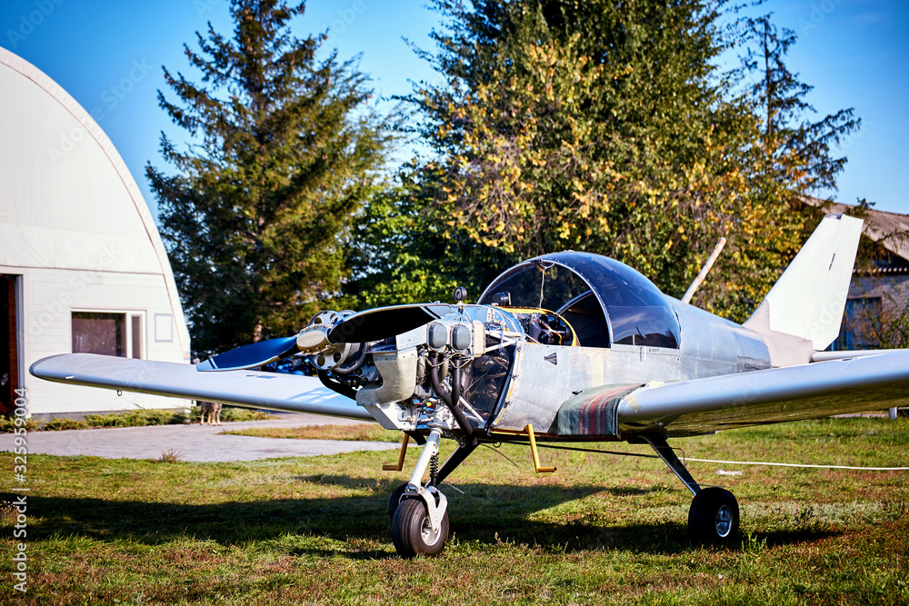 Lightweight single-engine aircraft ready for engine maintenance. Stock ...