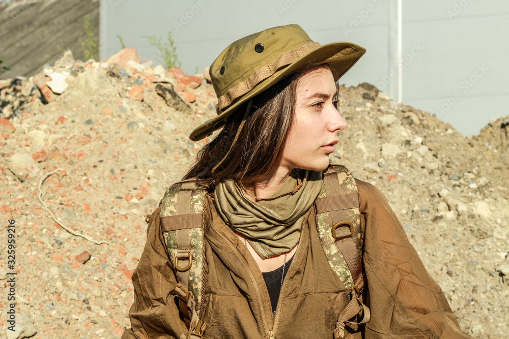 Girl in tactical clothing. Military woman in camouflage. Jungle ...