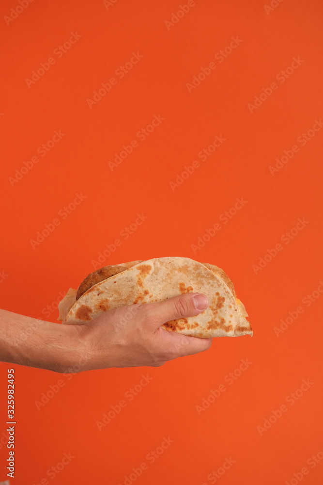 Mexican national food taco or Tatar national food kystyby in hand on an ...