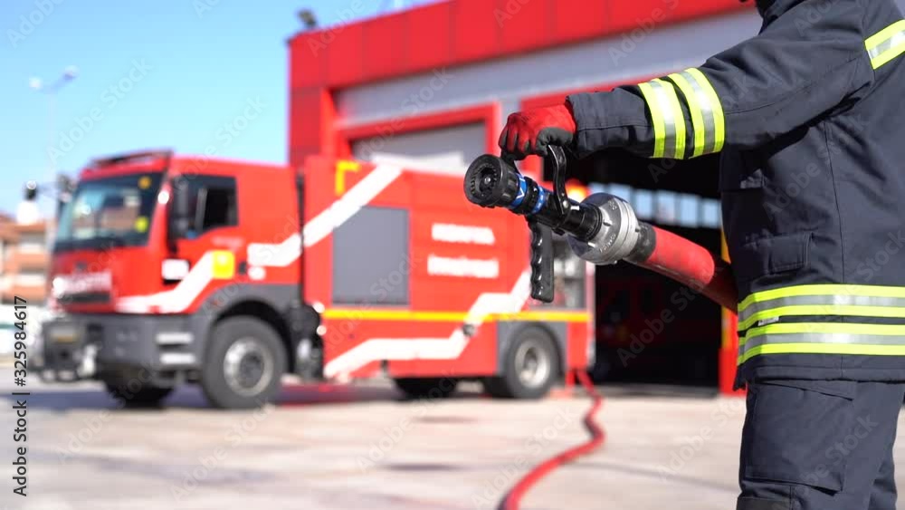 A fireman keeps fire hose for training. Slow motion and close up shot ...