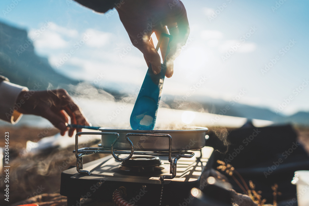 person cooking food in nature camping outdoor, cooker prepare breakfast ...