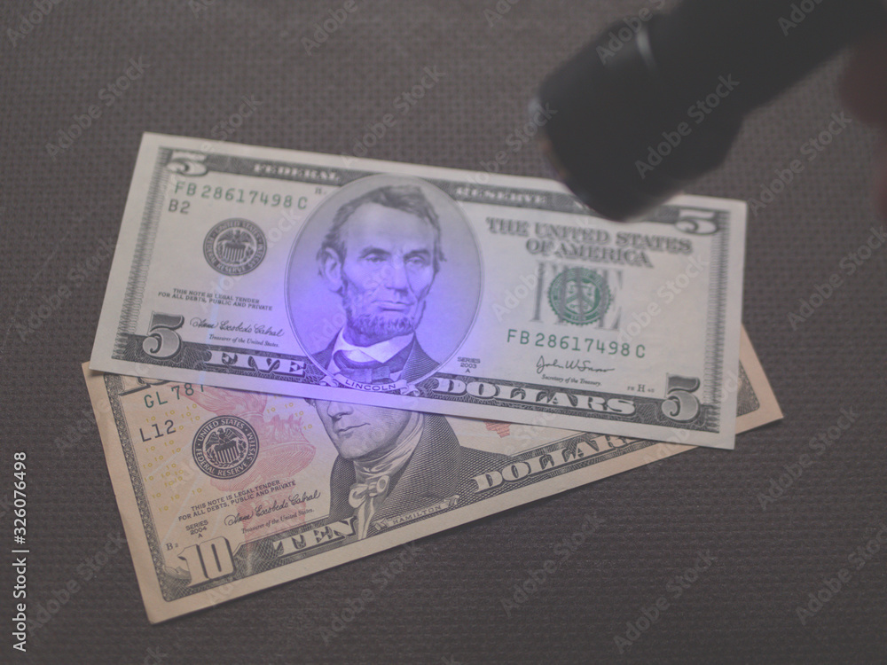 Dollar Banknote under UV Light Lamp Stock Photo | Adobe Stock