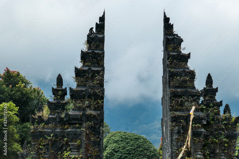 A close up on the front of iconic Bali Handara Gate on a cloudy day ...