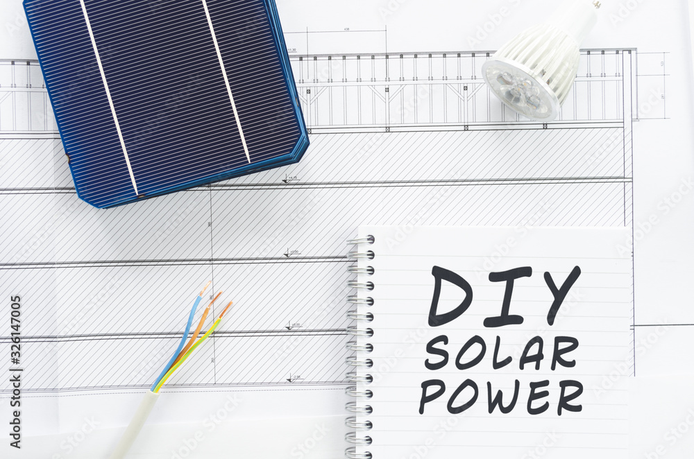 DIY solar power written on a notepad in a conceptual image of do it ...