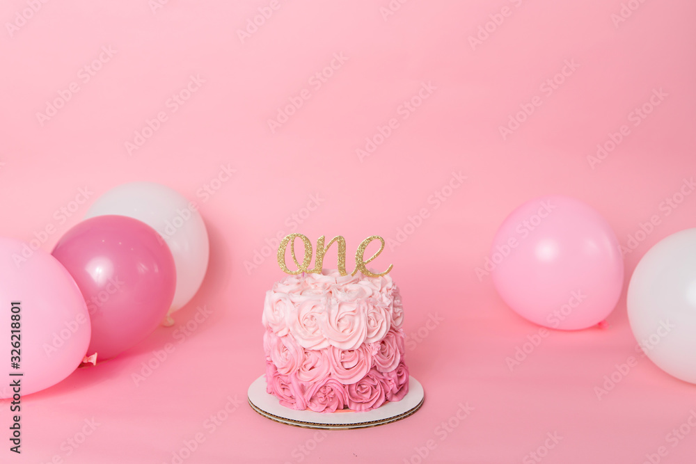 Pink studio backdrop with first birthday cake with shades of pink ...