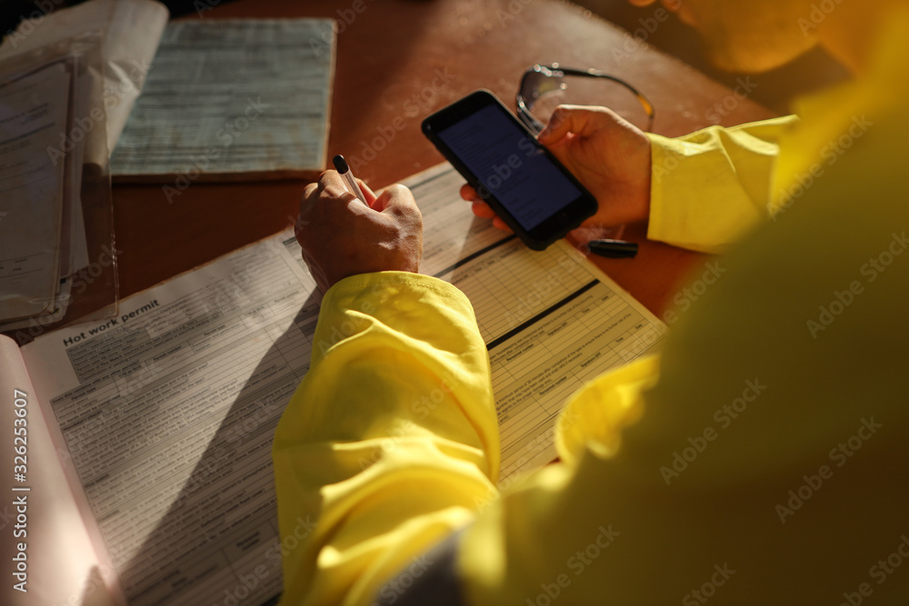 Safe workplace top view of construction worker setting on the chair ...